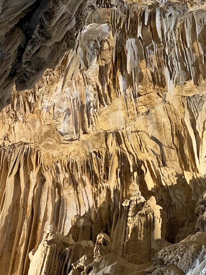 Gravity-defying mineral masterpieces cascade from the ceiling like a frozen waterfall. Mother Nature's sculpture garden puts human art installations to shame.