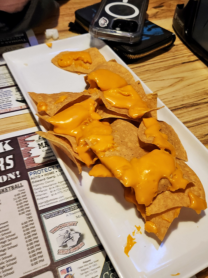 Nachos that understand the importance of proper cheese distribution. Every chip gets its fair share of that molten, yellow gold.