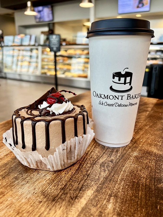 Coffee and cake: civilization's perfect pairing since forever. This chocolate-drizzled creation alongside Oakmont's brew is what breakfast dreams are made of.
