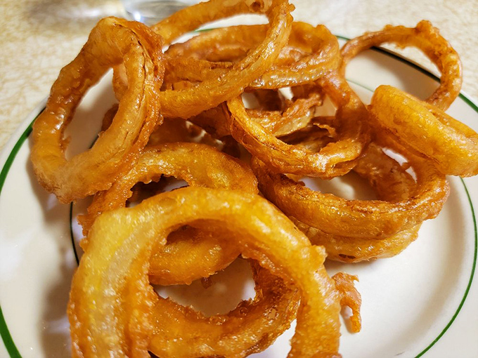 Onion rings that make you question your loyalty to french fries. Massive golden halos that shatter satisfyingly with each blissful bite.