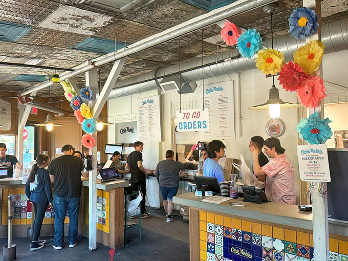Where burger dreams begin: the ordering counter at Chris Madrid's, where patient staff guide newcomers through life-changing menu decisions.