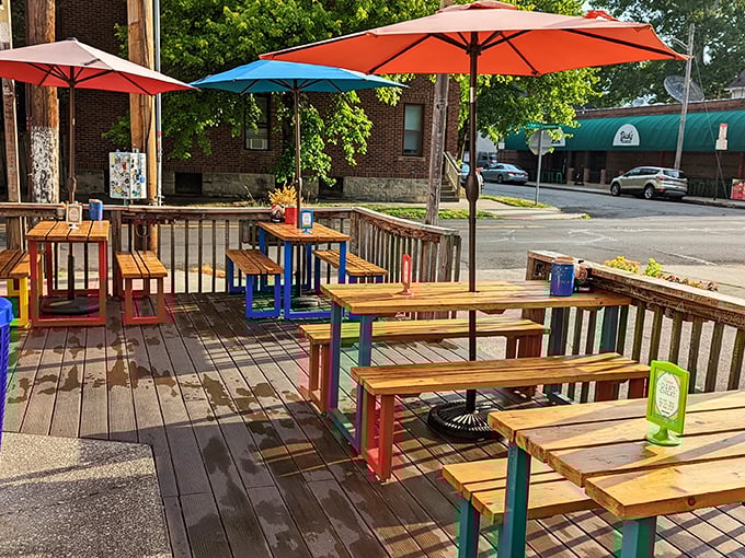 Rainbow-hued picnic tables under bright umbrellas&mdash;because breakfast this good deserves seating with personality to match the food.