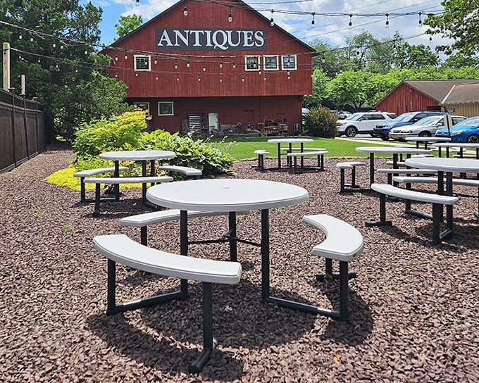 The outdoor seating area offers a peaceful respite beside the antique barn. Perfect for contemplating life's big questions, like "Should I order dessert?"