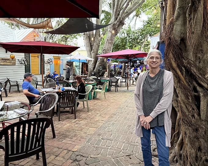 Outdoor dining under the dappled shade of tropical trees&mdash;nature's dining room where every table feels like the best seat in the house.