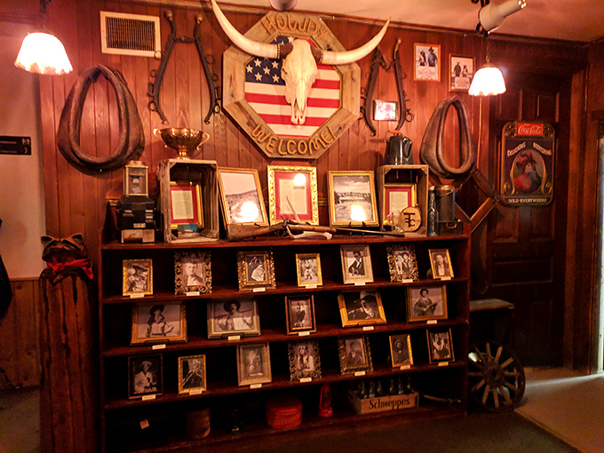 The "Howdy Welcome" wall display, complete with longhorn skull and American flag, sets the tone for an evening where Western hospitality isn't just suggested&mdash;it's guaranteed.