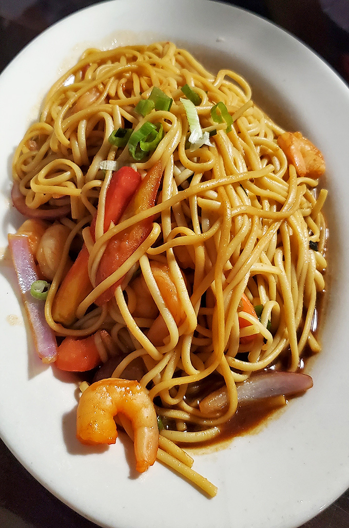 Tallarines with shrimp &ndash; where Italian pasta meets Peruvian seasoning. Those plump shrimp look like they're doing the backstroke in deliciousness.