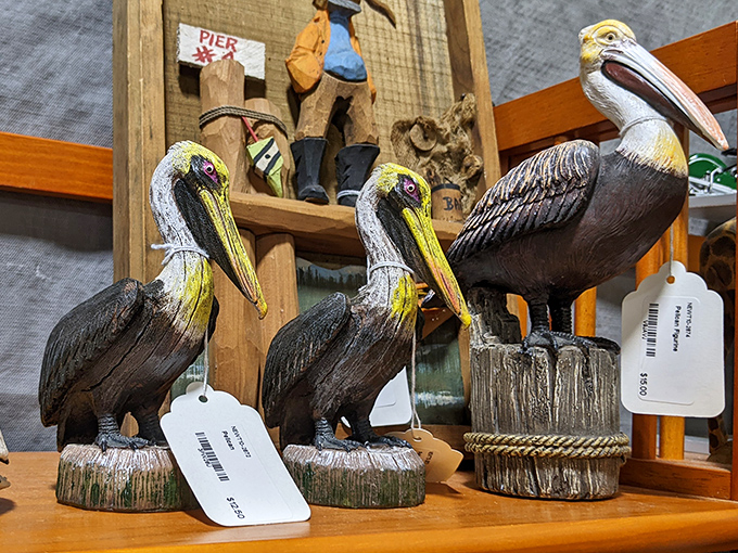 Florida's unofficial state birds&mdash;wooden pelicans perched and ready for adoption. These coastal sentinels are waiting to stand guard on someone's porch.