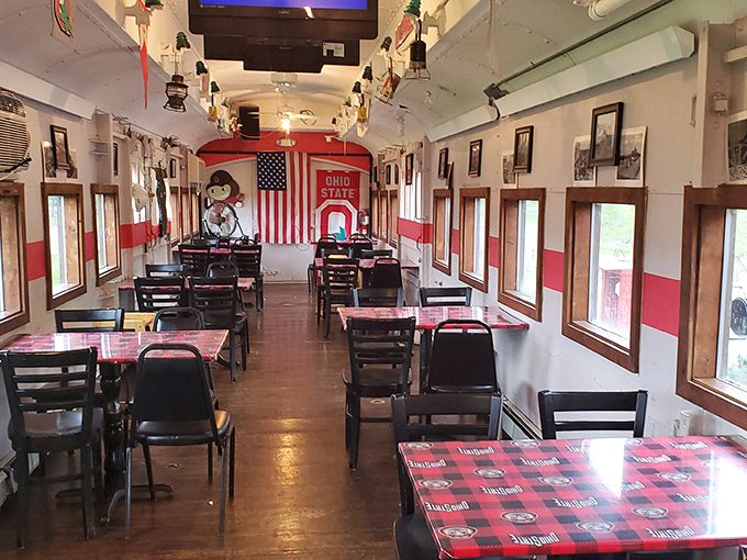 The dining car's interior stretches before you like a scarlet and gray runway. Every table offers a window to Ohio countryside.