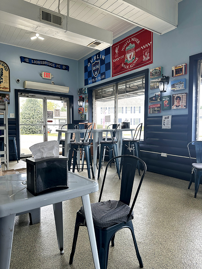 The blue-walled dining area feels like you've stepped into a Liverpool supporter's living room. Football flags and memorabilia create an instant community.