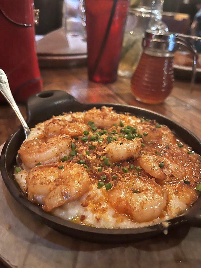 Shrimp and grits wearing a sprinkle of chives like a jaunty hat. Southern comfort food dressed for a night on the town.