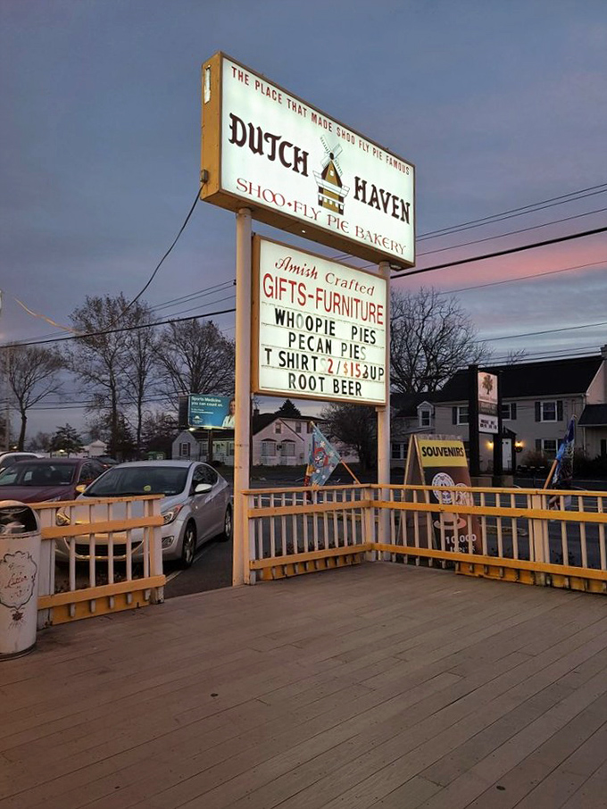 As dusk settles, the illuminated sign becomes a lighthouse for dessert pilgrims seeking shoofly salvation after a long day of Amish country exploration.