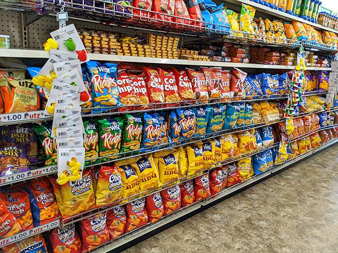 Chip bags stacked like edible Tetris pieces. A salty, crunchy wonderland where diet resolutions go to die gloriously and deliciously.