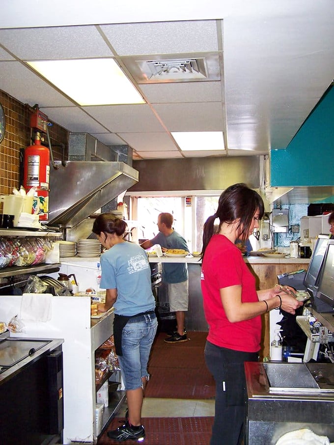 The kitchen crew—breakfast's unsung heroes—orchestrating your morning masterpiece with practiced precision and genuine Florida hospitality.