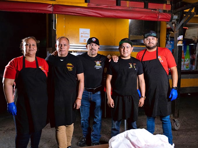 The maestros behind the magic. Like a well-rehearsed band, this crew orchestrates hot dog perfection night after night.