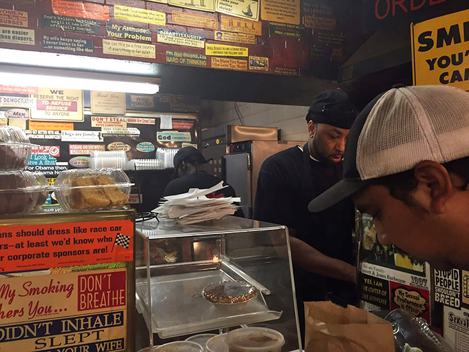 The sacred exchange: hungry customers meeting the keepers of the flame, where barbecue dreams become delicious reality.