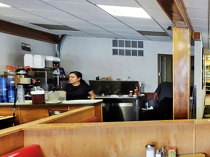 The kitchen staff moves with practiced precision, orchestrating the breakfast symphony that keeps loyal customers coming back for decades.