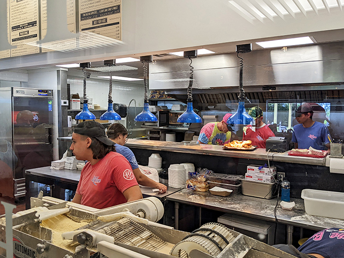 Where the magic happens&mdash;the kitchen crew orchestrates a symphony of frying, plating, and serving that keeps seafood lovers coming back.