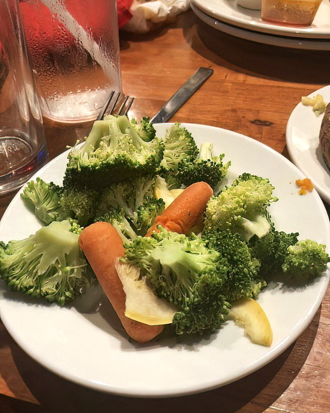 Proof that vegetables aren't just an afterthought &ndash; these vibrant steamed broccoli florets and carrots provide a welcome counterpoint to protein indulgence.