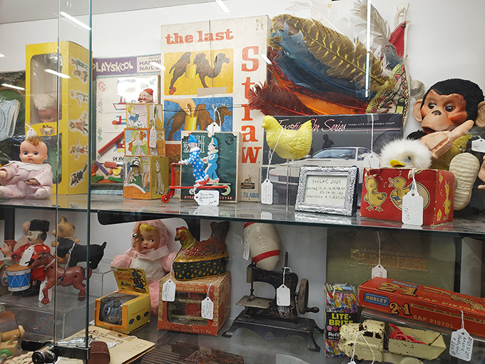 Vintage toys behind glass&mdash;childhood memories preserved like insects in amber, price tags now attached.