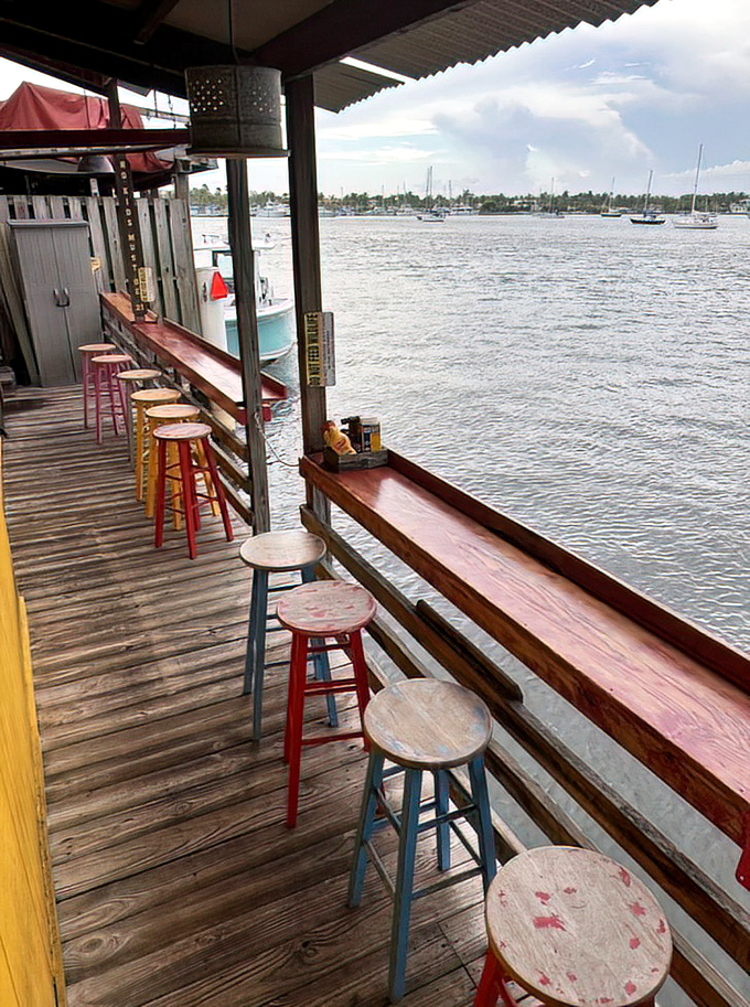 The bar stools along the waterfront offer front-row seats to nature's best show: boats, birds, and the occasional manatee passing by.
