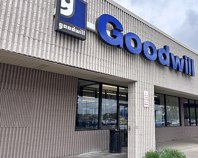 Goodwill's iconic blue sign is like a lighthouse beacon guiding bargain hunters safely to shore.