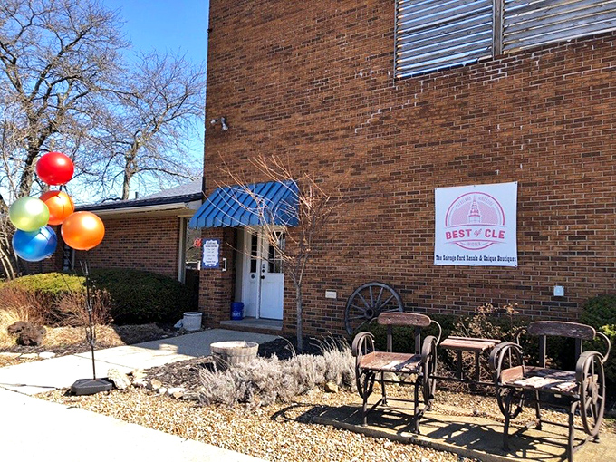 The Salvage Yard's charming sign promises adventures in upcycling and vintage finds. Those colorful balloons aren't celebrating a birthday&mdash;they're celebrating great deals!