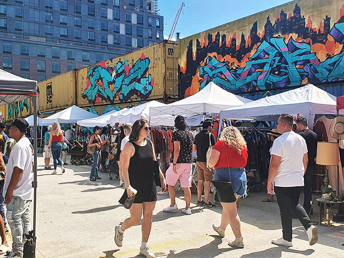 Urban archaeology under blue skies. Greenpoint's market creates a colorful bazaar against the backdrop of Brooklyn's ever-changing landscape.