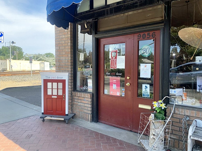This charming storefront with its literal red door promises treasures curated with love and displayed with care.