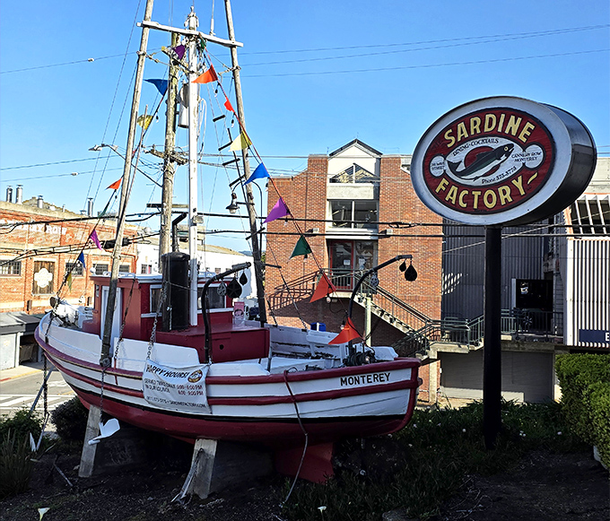 Colorful flags flutter above a vessel that hasn't caught anything lately except the attention of hungry passersby.
