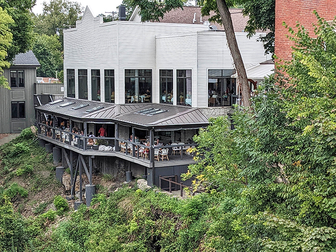 Dining with a view at this riverside restaurant, where the outdoor patio dangles over nature like the world's most civilized treehouse.