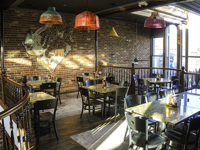 Dining with altitude&mdash;colorful pendant lights and exposed brick create the perfect backdrop for food that deserves a stage.