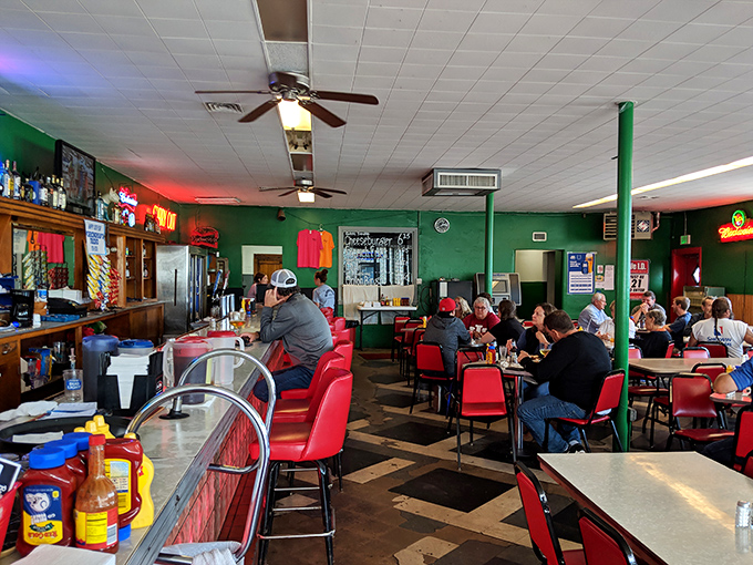 Red chairs, green walls, and checkered floors create the perfect backdrop for the serious business of enjoying unpretentious food.