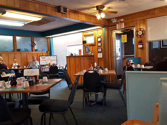 The classic diner experience preserved in its natural habitat—wood paneling, comfortable seating, and the promise of hearty food served with a smile.