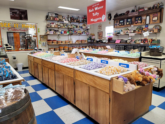 Wooden bins overflow with colorful taffy varieties, creating a rainbow of sugar that's practically begging to be photographed for social media.