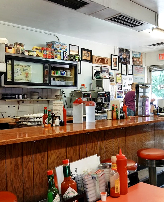 The wood-paneled time capsule where condiments stand ready for duty and every stool holds stories of breakfasts past.