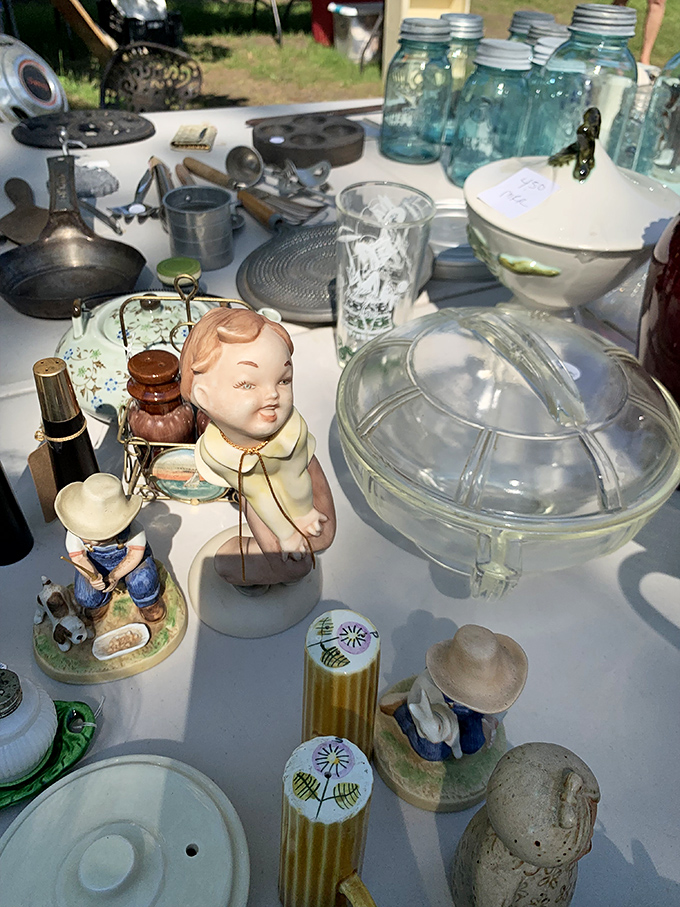 Porcelain personalities await adoption. Vintage figurines and classic glassware create a still life that's part museum, part opportunity for your next conversation piece.