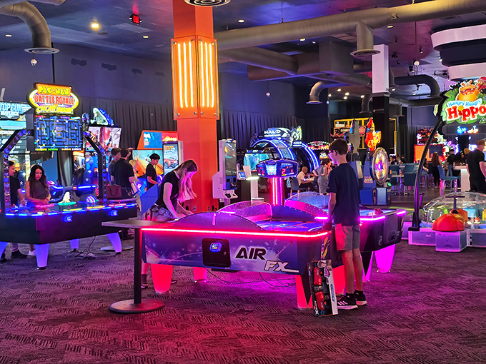 The arcade glows like a neon wonderland where quarters disappear faster than good parking spots. 