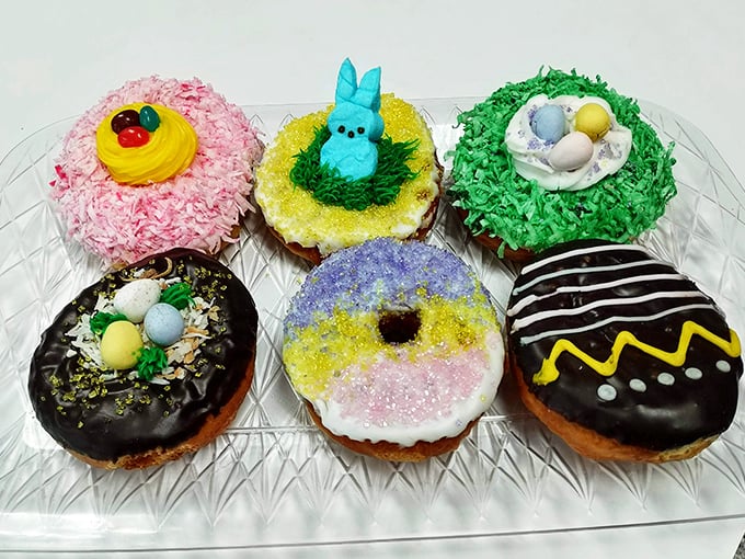 Easter donuts that look like they were decorated by Willy Wonka after a particularly joyful spring morning.