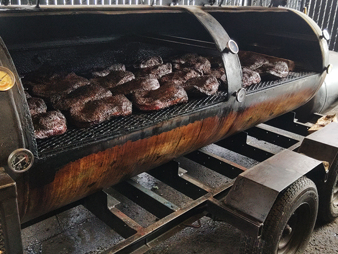 The offset smoker&mdash;barbecue's iron throne&mdash;where patience transforms tough cuts into tender treasures through the ancient alchemy of fire and time.