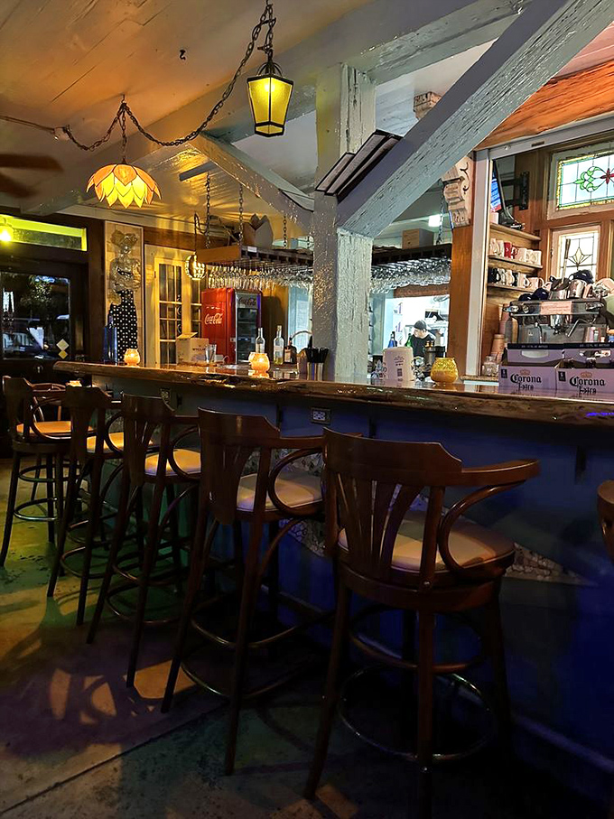 Evening magic happens at this bar, where stained glass lamps cast a glow that makes everyone look like they belong in a Florida postcard.