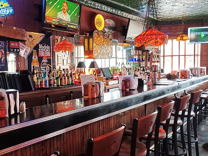 Where locals gather to share stories over cold drinks. The bar area maintains that perfect balance of neighborhood joint and tourist destination.