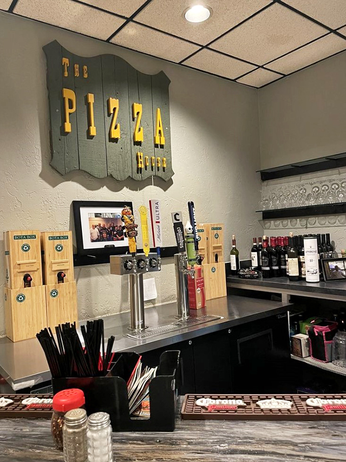 The wooden sign proclaims what generations already know: this is THE Pizza House, where Columbus comes for comfort and community.