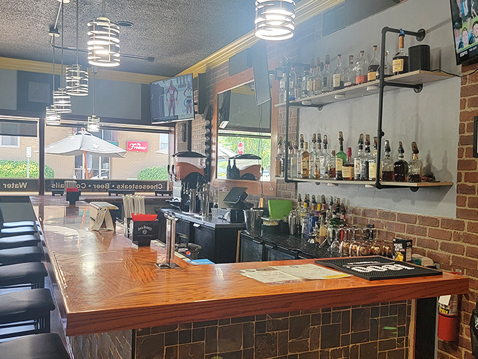 The bar where cheesesteak dreams come with a side of spirits. Those industrial pipes and warm wood create the perfect backdrop for indulgence.