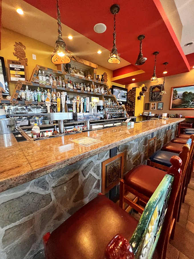 The bar isn't just serving drinks&mdash;it's dispensing liquid sunshine in margarita form beneath a ceiling that mimics a Mexican sunset.