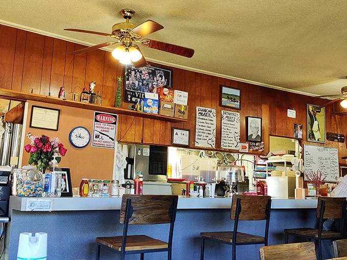 The counter where breakfast magic happens &ndash; wood-worn and welcoming, with stools that have supported generations of hungry Raleigh residents.