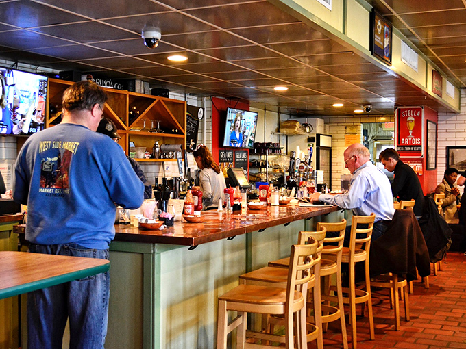 Counter culture at its finest—where regulars perch on stools, trading stories while watching the kitchen ballet unfold before them.