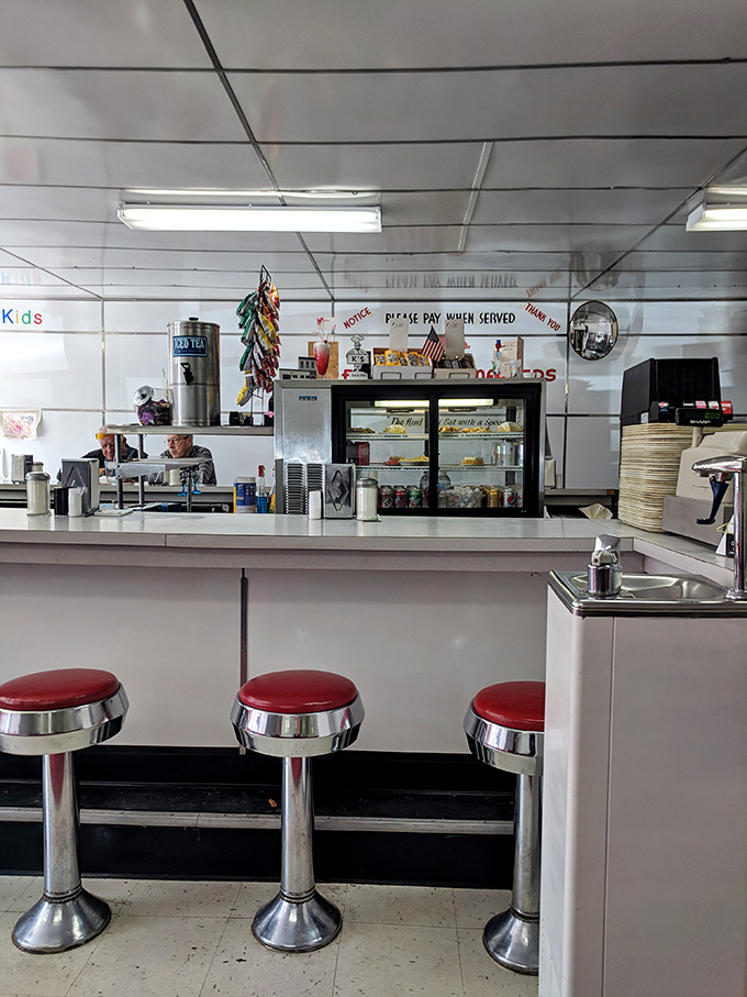 Those red-topped counter stools have witnessed first dates, business deals, and countless regulars starting their day with coffee and conversation.