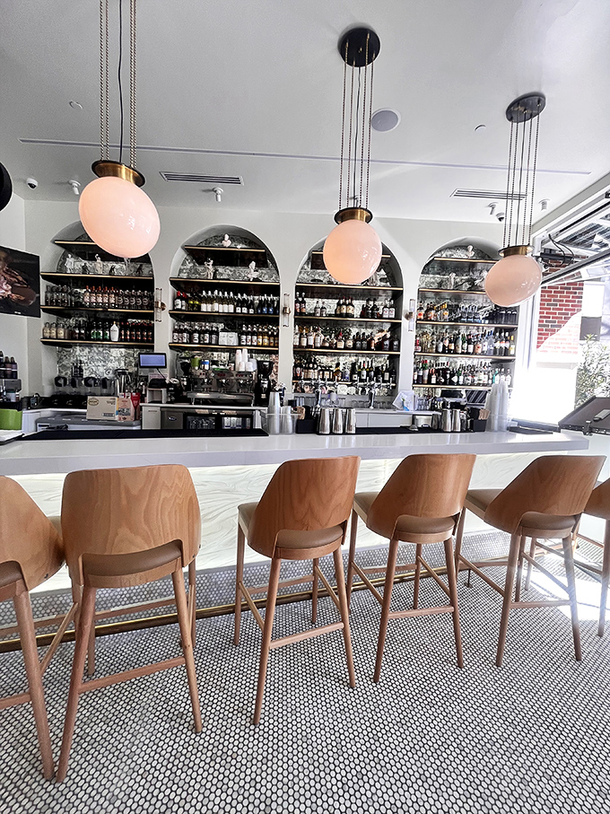 The bar area invites you to perch, sip, and contemplate life's important questions&mdash;like "Can I try all the cocktails in one visit?"