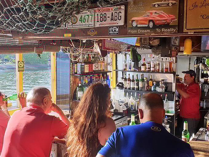 At this bar, license plates from around the country tell stories of pilgrims who traveled far for burgers, shrimp, and waterfront views worth bragging about.