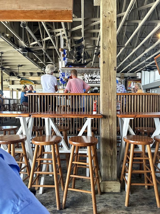 Bar seating that invites lingering conversations with strangers who quickly become friends – the true magic of authentic beach establishments.